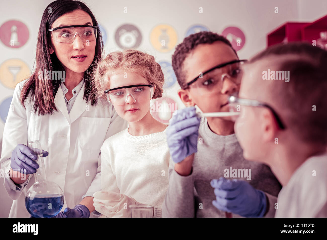 Elementary school group looking surprised on their classmate Stock ...
