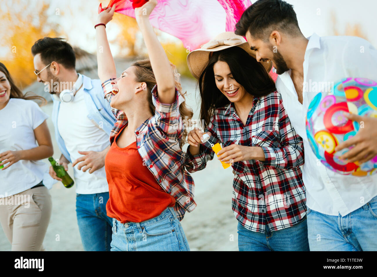 Group people partying tropical beach hi-res stock photography and ...