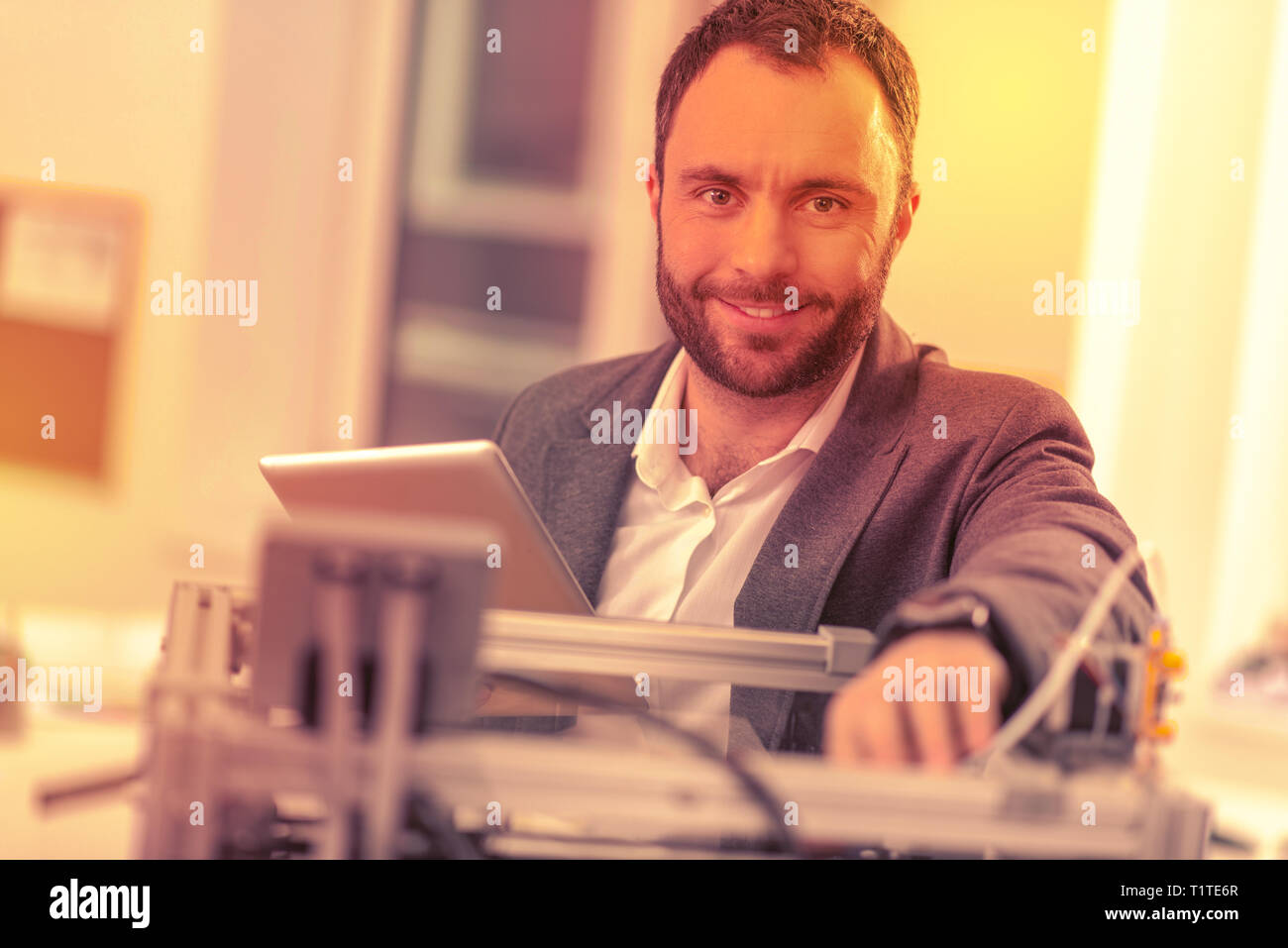 Handsome successful boss posing cheerfully for the picture Stock Photo ...