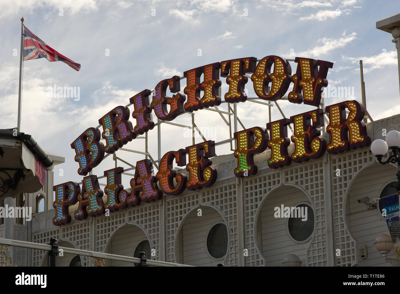 Illuminated sign for Brighton Palace Pier on seafront at Brighton, East ...