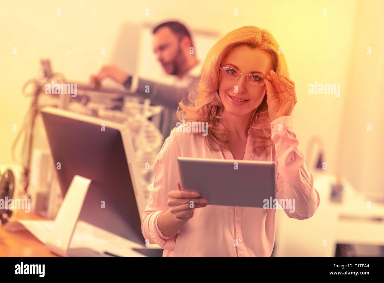 Successful intelligent lady with glasses posing for the camera Stock ...