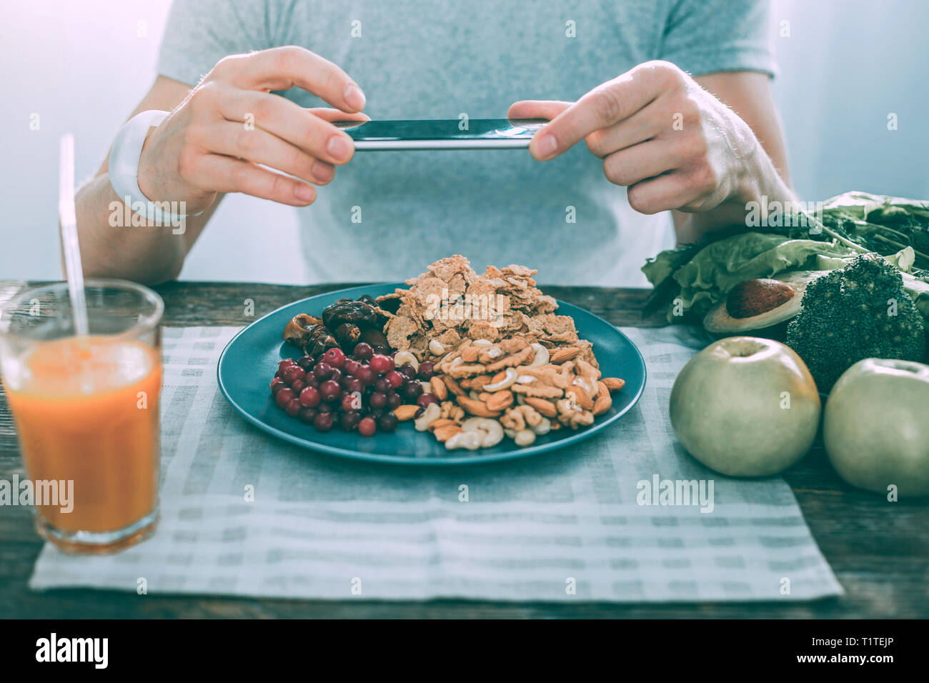 Interested inspired man making shooting food on a plate Stock Photo - Alamy