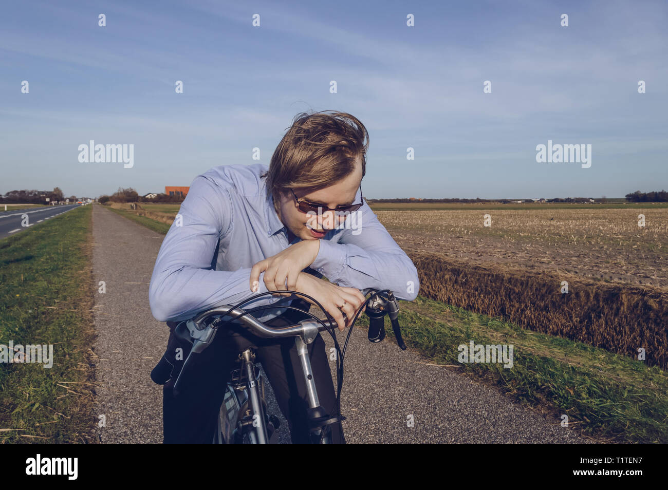 Man bicycle exhausted hi-res stock photography and images - Alamy