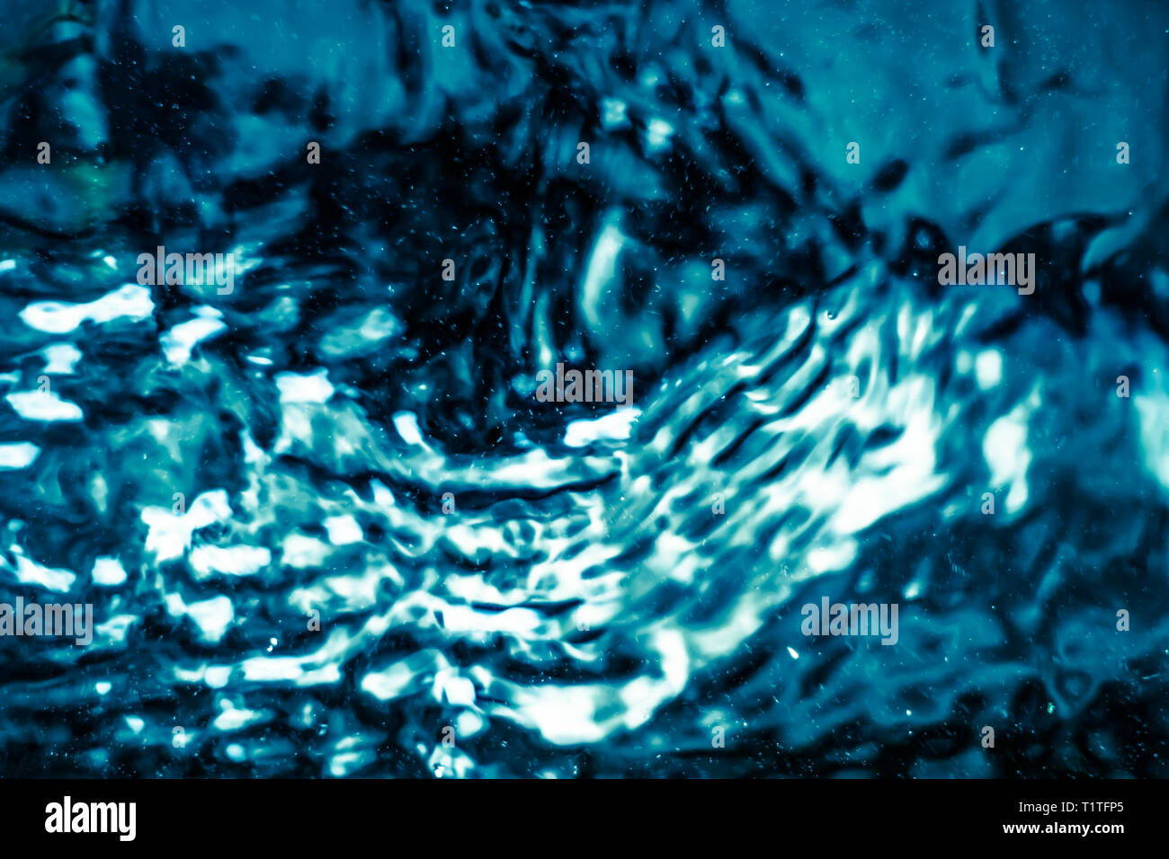 Abstract blue liquid surface as background - futuristic design and ...