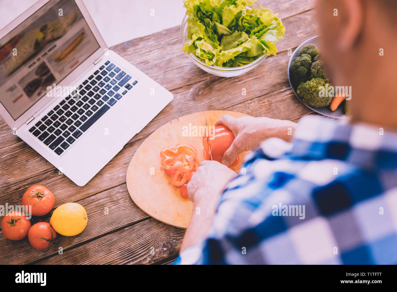 Careful man cooking dinner for his family Stock Photo - Alamy