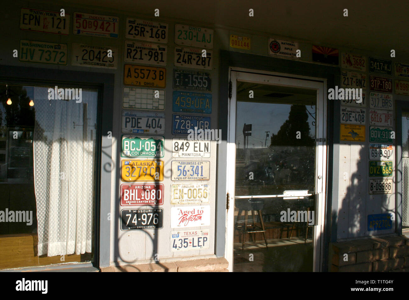Vehicle license plates used to decorate the facade of small bistro in ...