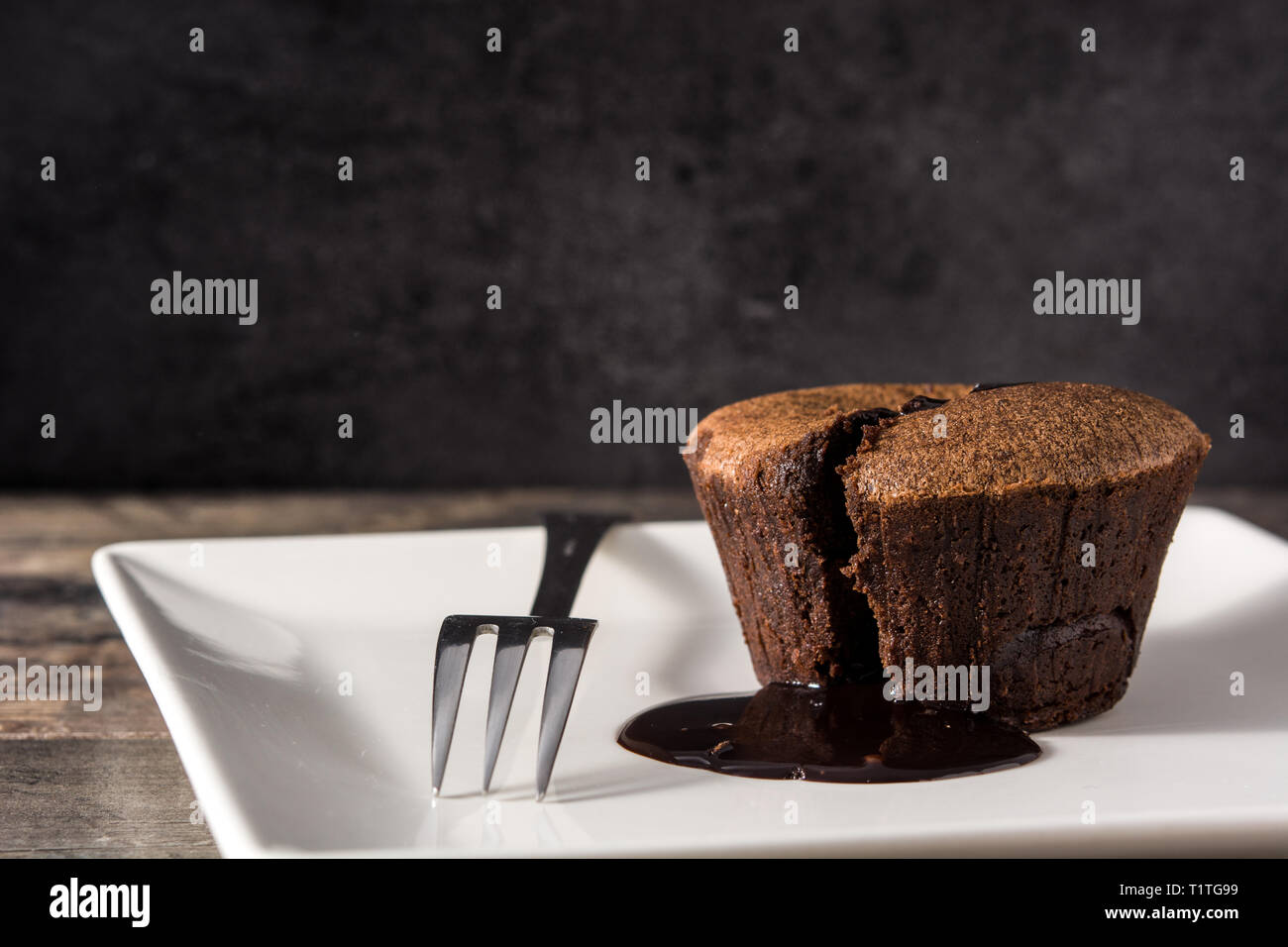 Coulant chocolate cake on wooden table. Copyspace Stock Photo - Alamy