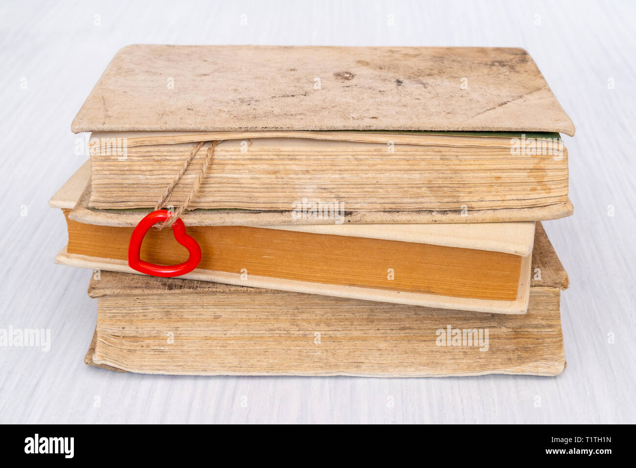 Old books with red heart on the string. Book love concept.Valentine's ...