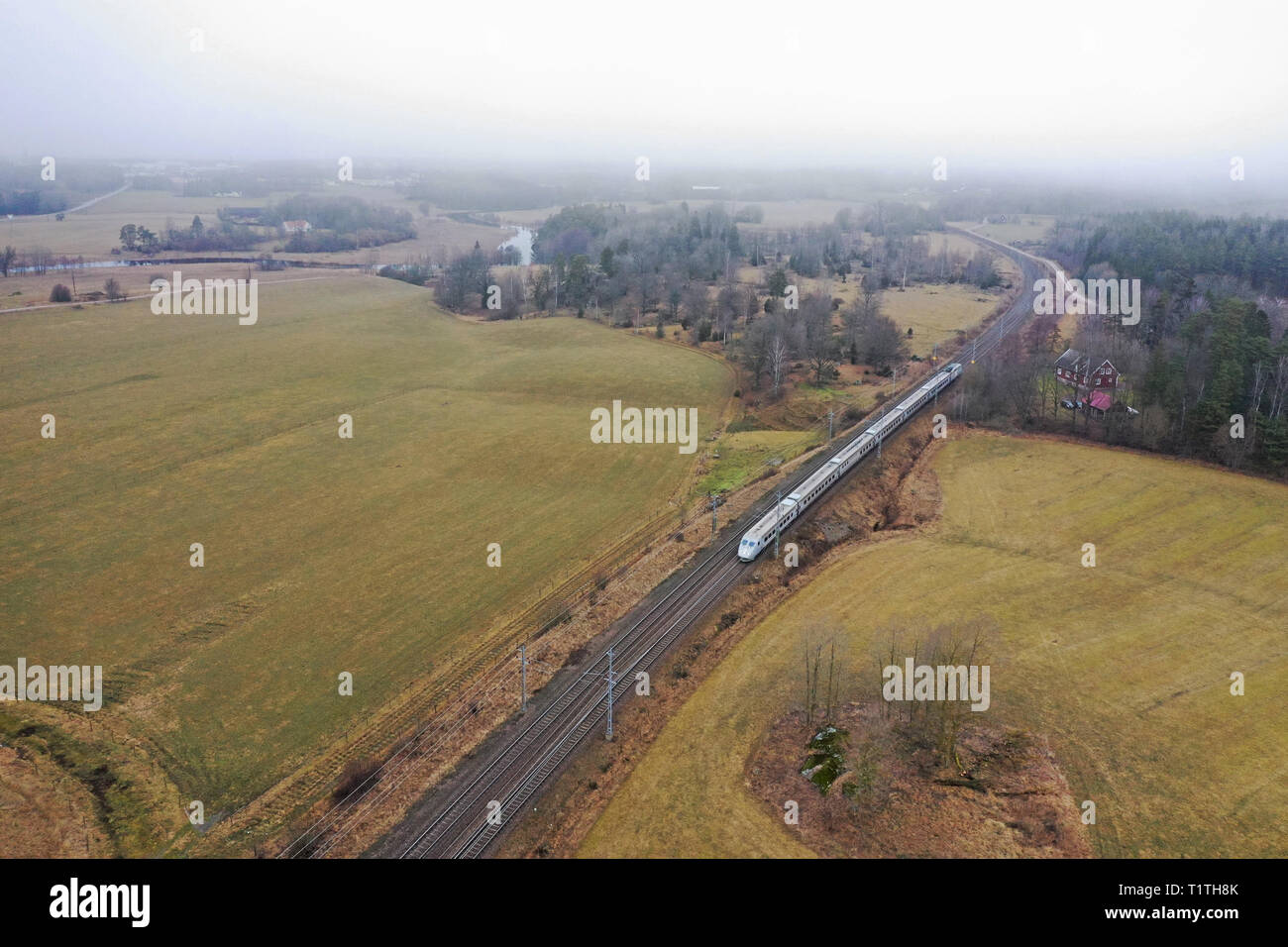 MJÖLBY 20190304 Aerial view of a railway and the high-speed train X2000 ...