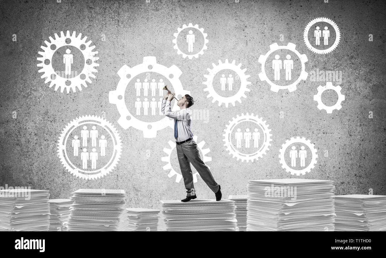 Happy businessman playing fife Stock Photo - Alamy