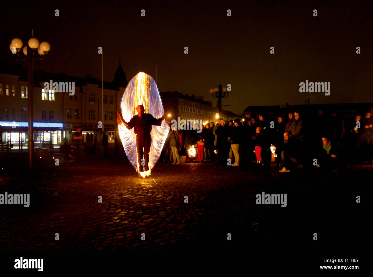 People in a square during Earth Hour Stock Photo - Alamy