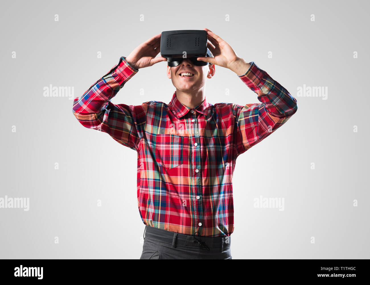 Guy in mask experiencing virtual reality as new entertainment device ...