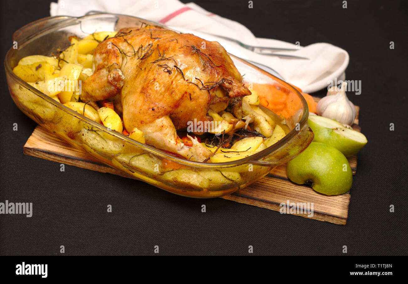 oven-baked crispy crust stuffed chicken on a plate with potatoes and ...