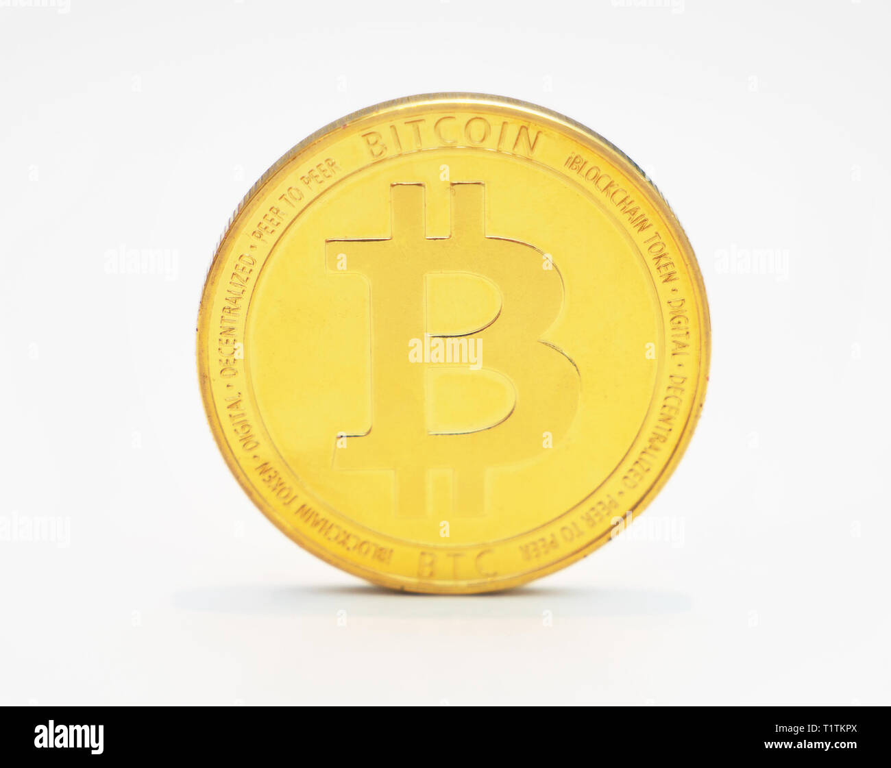 Physical version of golden bitcoin on white background Stock Photo - Alamy