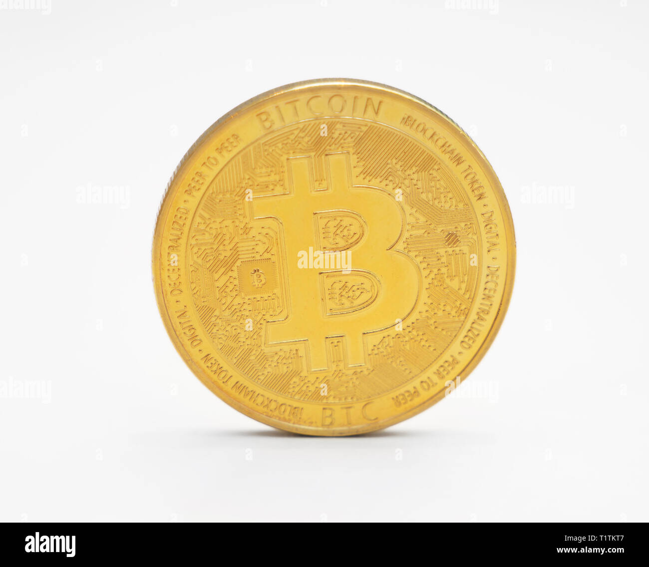 Physical version of golden bitcoin on white background Stock Photo - Alamy