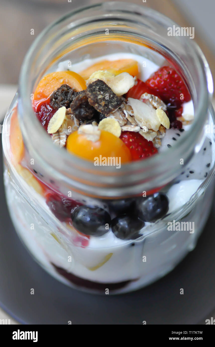 natural yogurt with fruit topping Stock Photo - Alamy