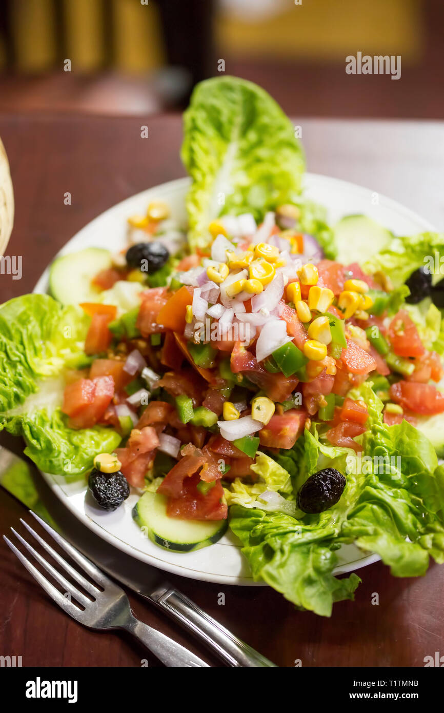 Traditional moroccan salad with cucumbers, tomatoes, peppers, olives ...