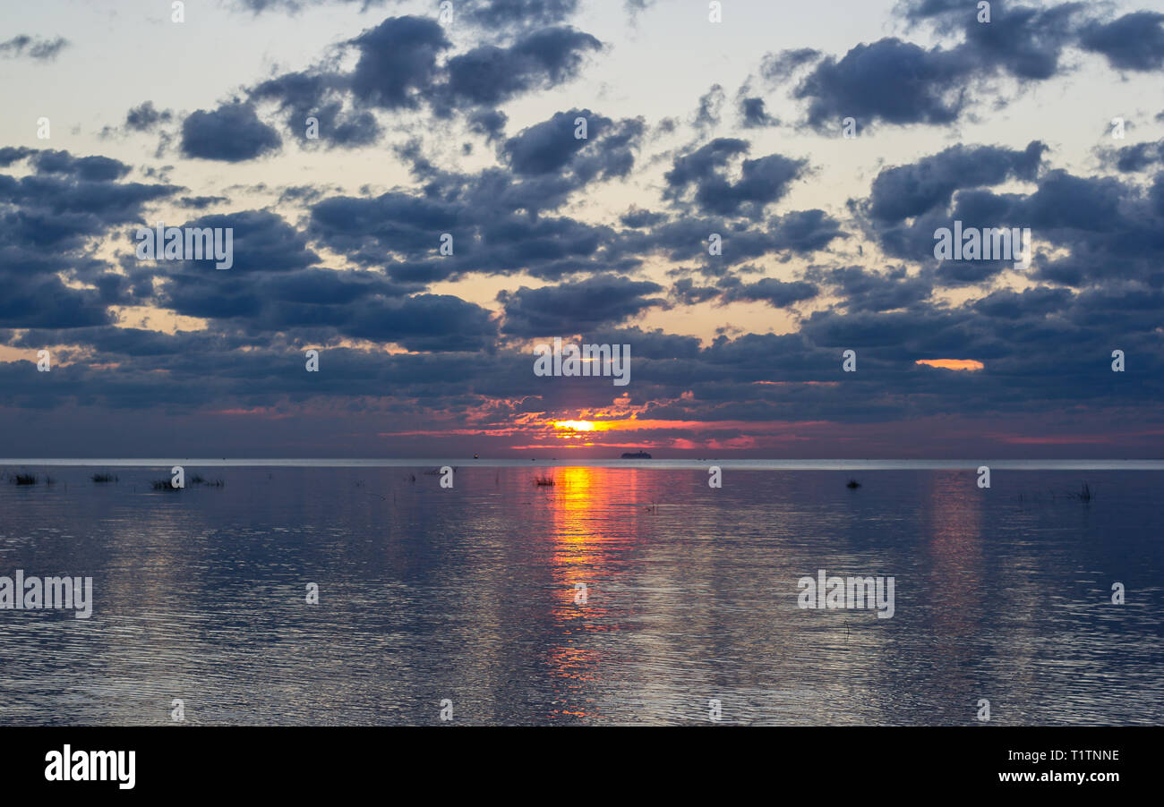 Unusual sunset on the sea. Sea sunset background. Evening sunset Sea ...