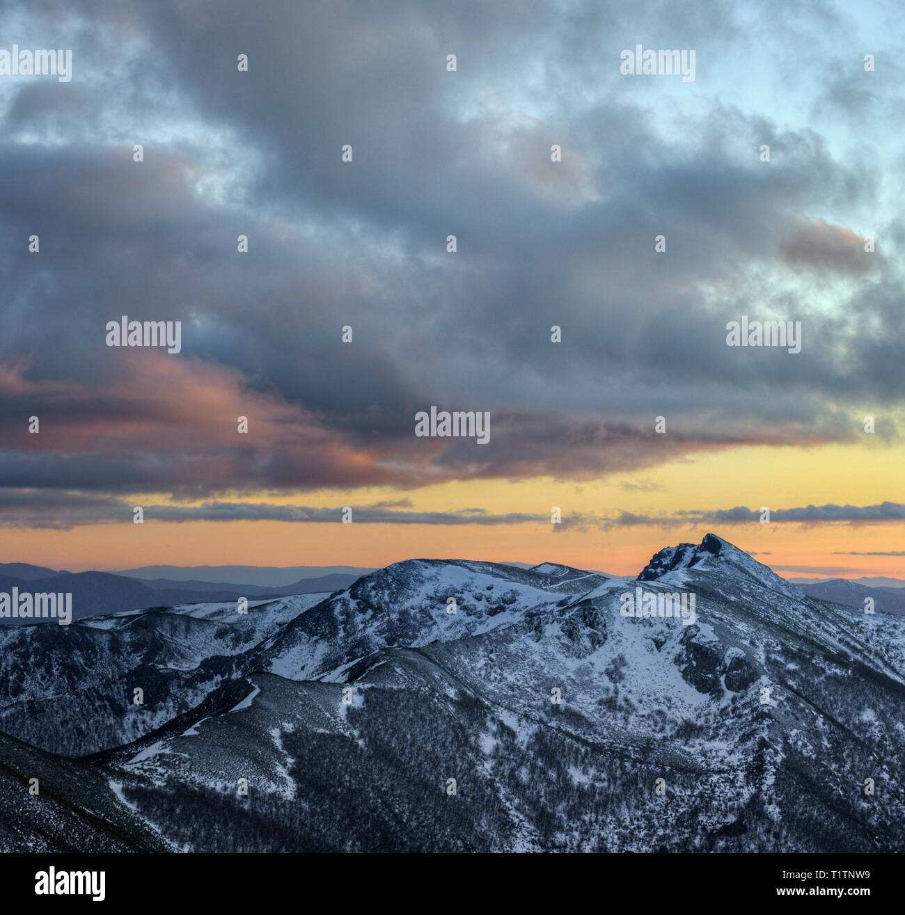Golden clouds at sunset over the Ancares mountain range, in Galicia ...