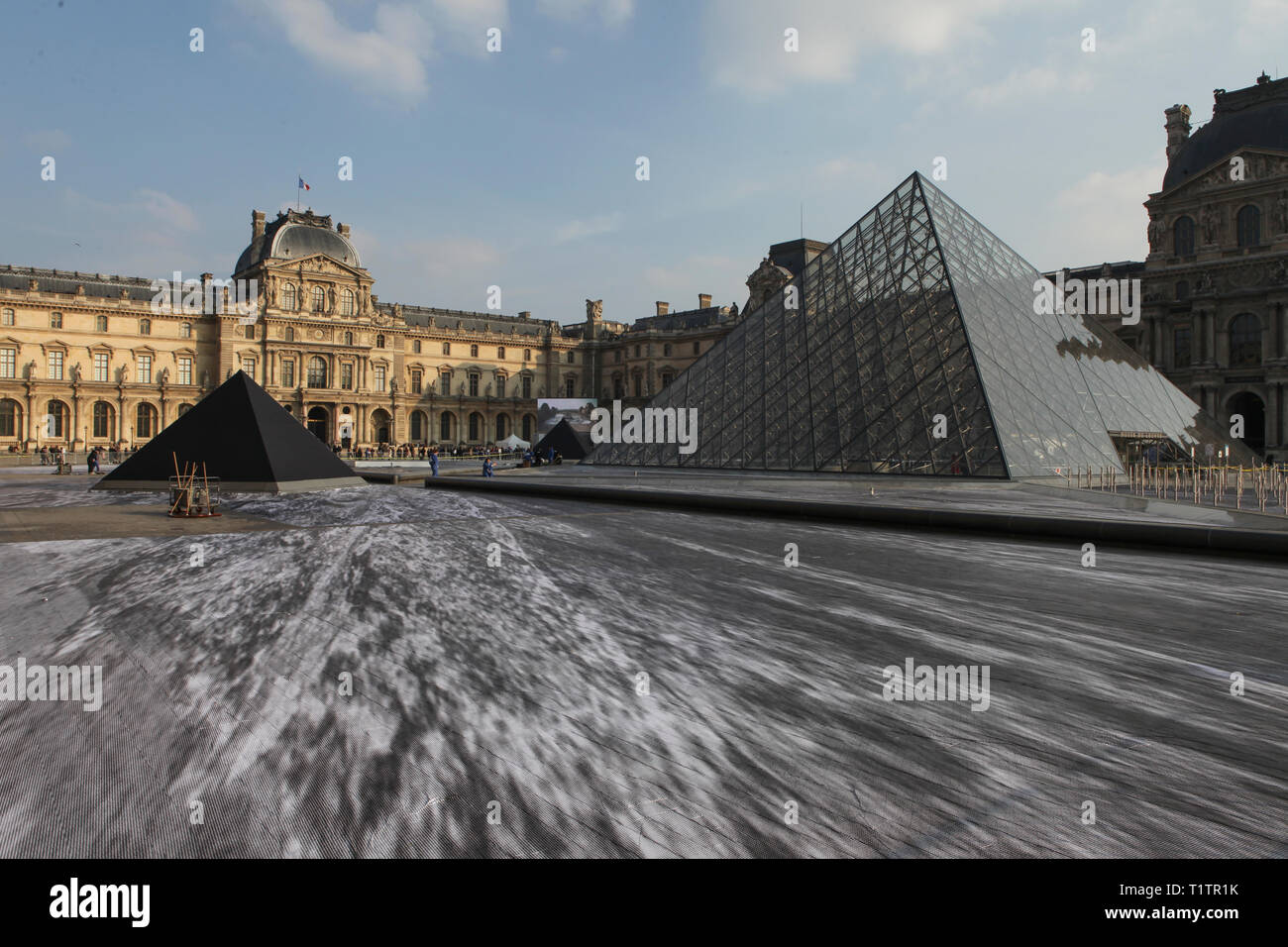 The street artist JR transforms the courtyard of the Louvre. For the ...