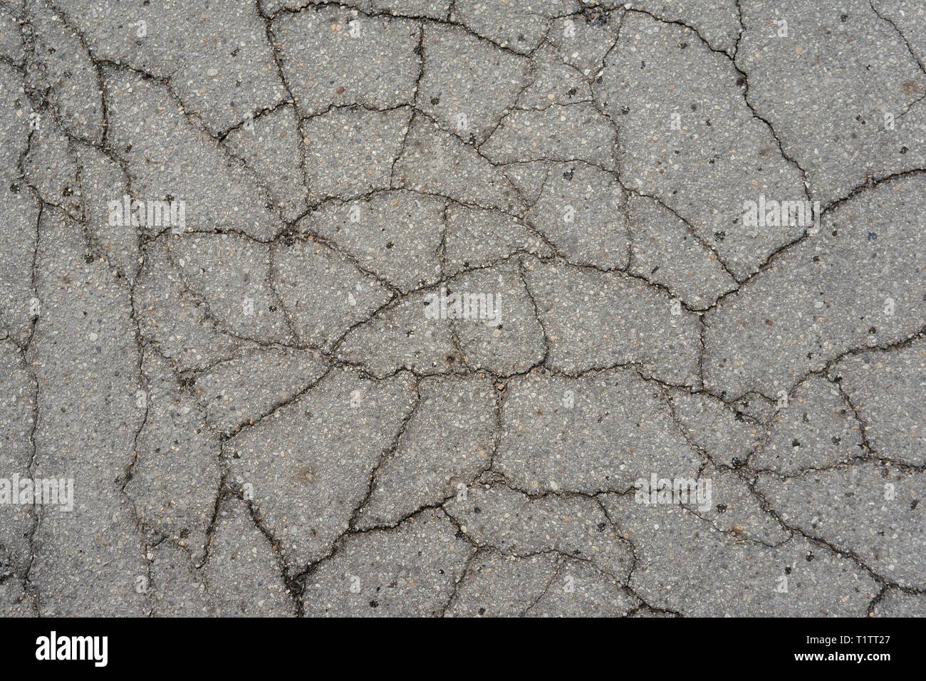 destructed tar road in a town Stock Photo - Alamy