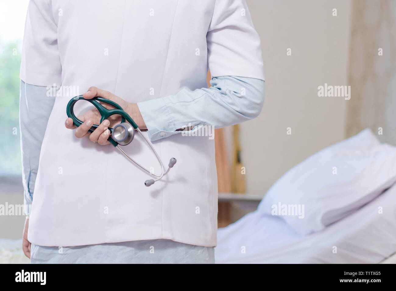 body part of female doctor hand inside hospital bed room Stock Photo ...