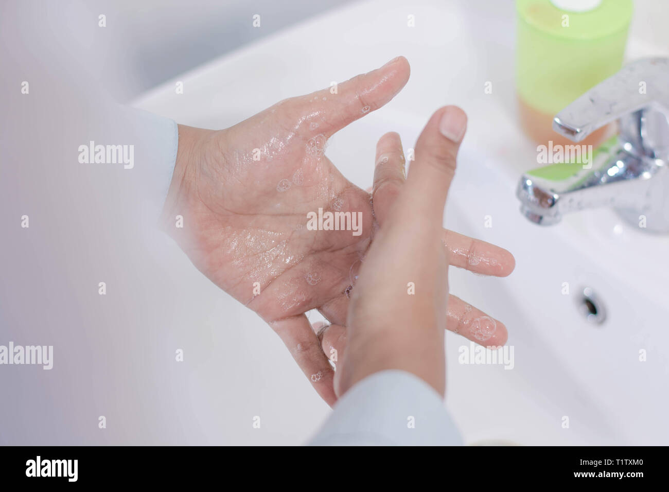 female doctor hand washing in the sink with soap foam Stock Photo - Alamy
