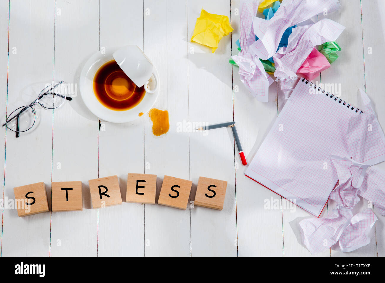 Stationery and word STRESS made of letters on wooden background ...