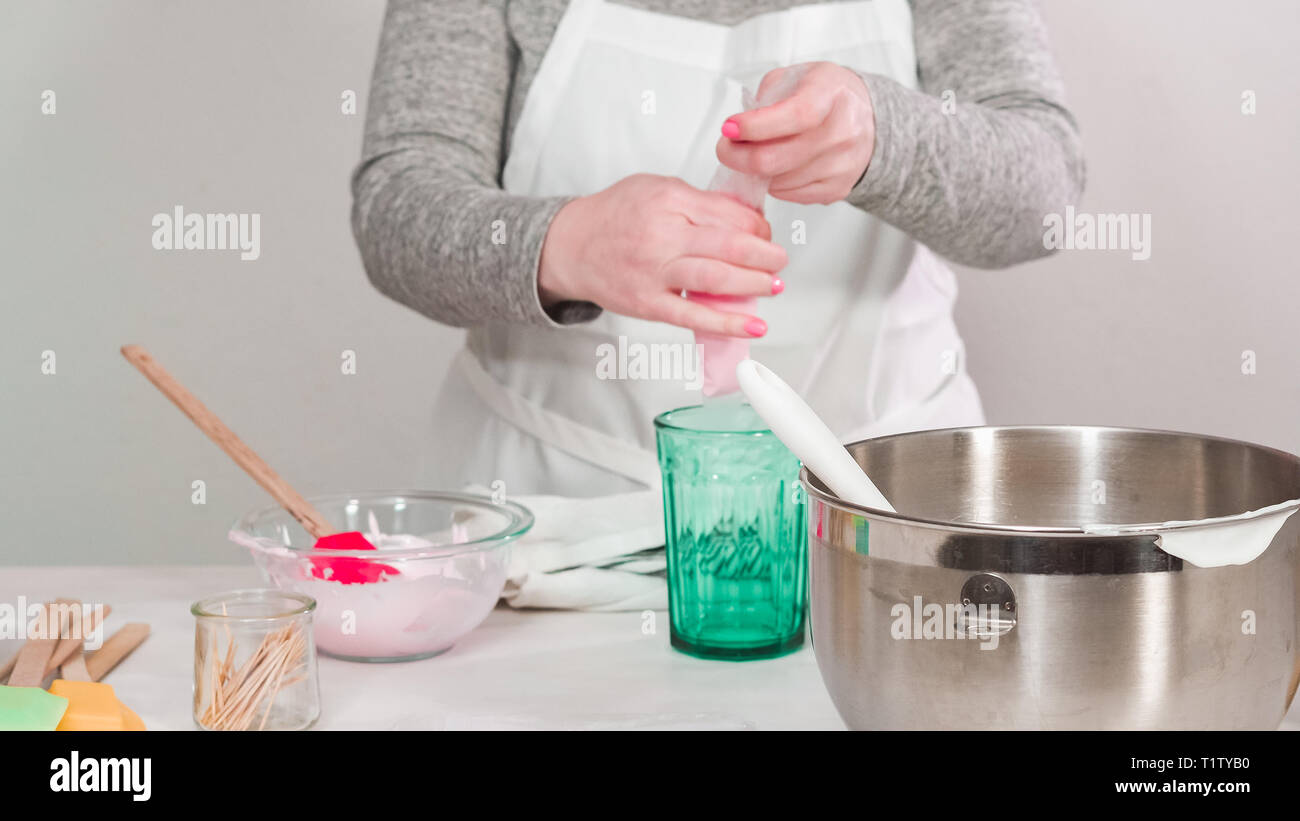 Step by step. Flat lay. Mixing royal icing in electric kitchen mixer ...