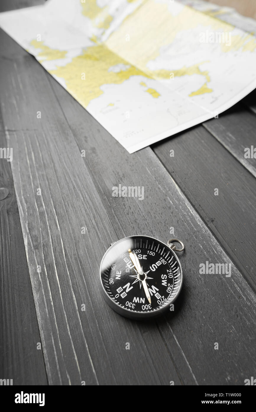 compass on the wooden table background Stock Photo - Alamy