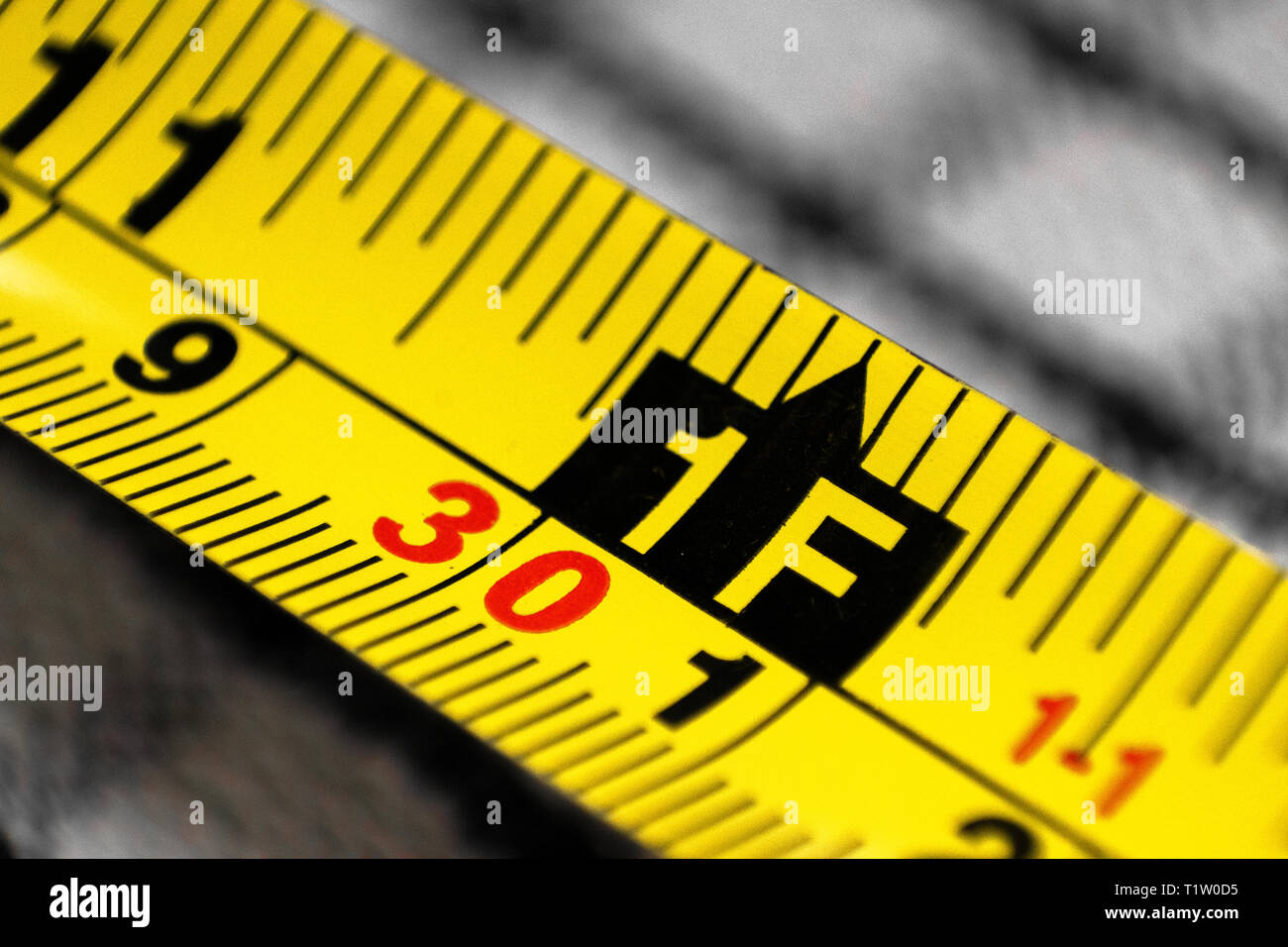 Yellow Tape Measure Showing Measurement In Metres And Feet Stock Photo