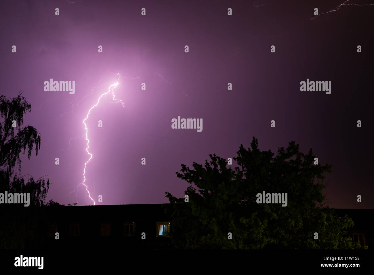 Lightning thunderstorm over city Stock Photo - Alamy