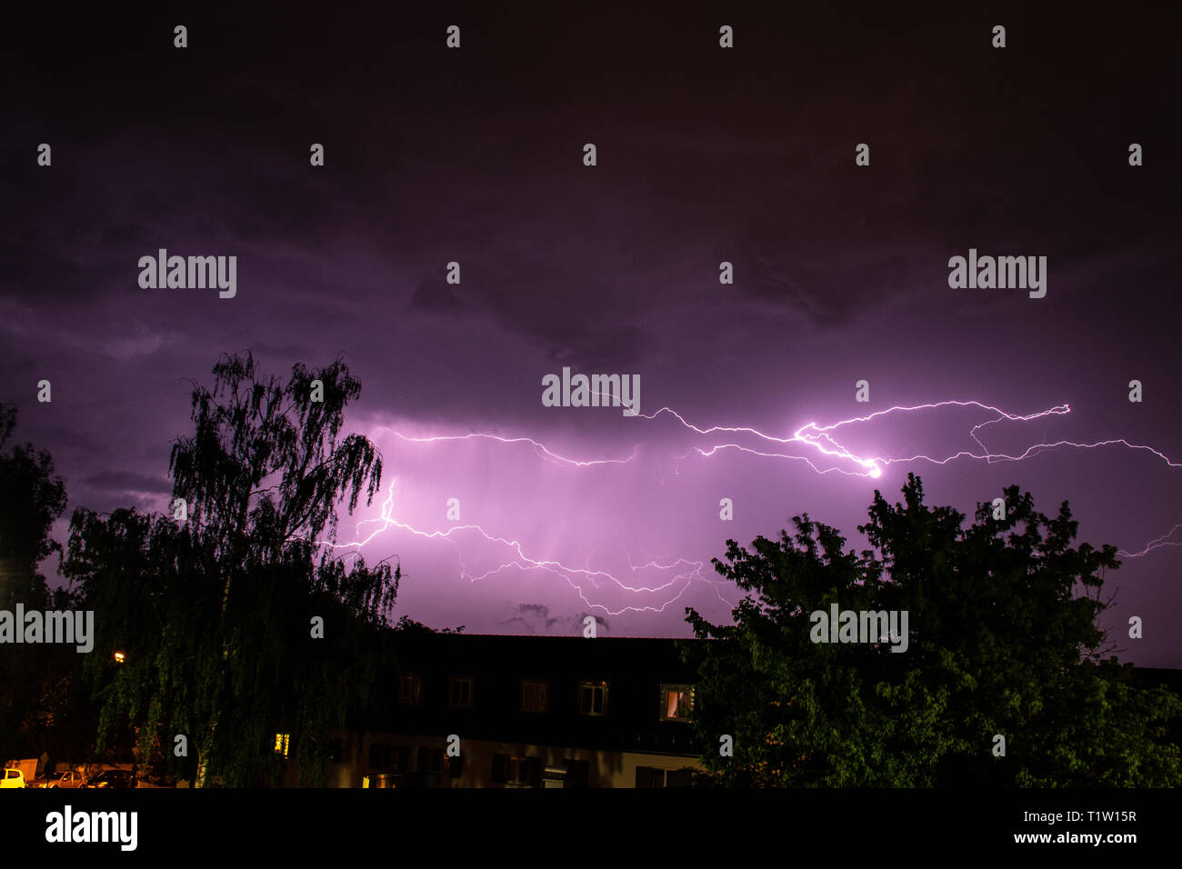 Lightning thunderstorm over city Stock Photo - Alamy