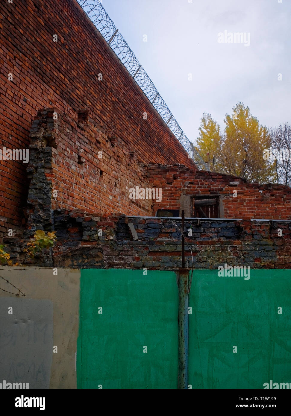 old brick building behind barbed wire, Moscow Stock Photo - Alamy