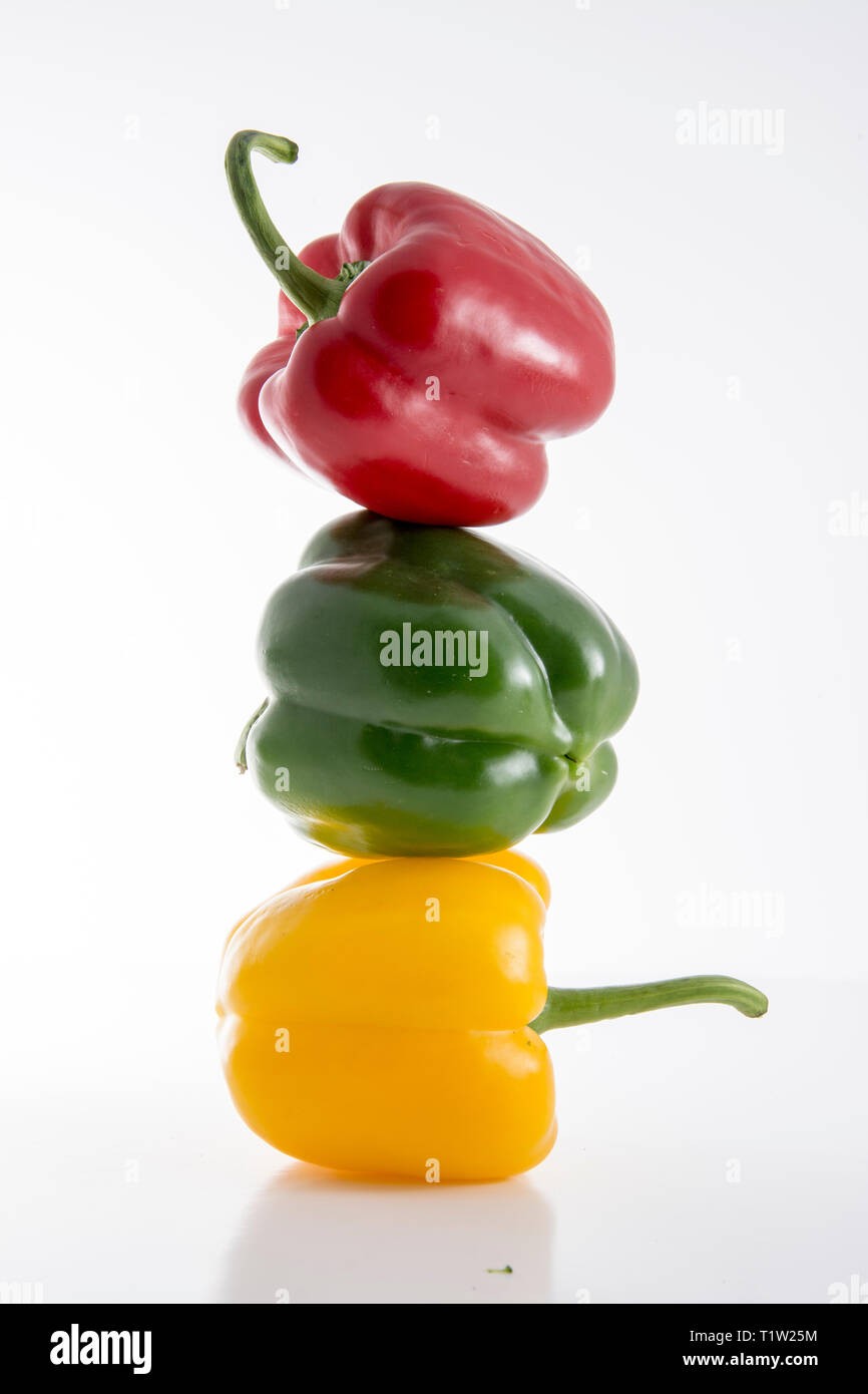 Red, green and yellow British peppers on white background Stock Photo ...