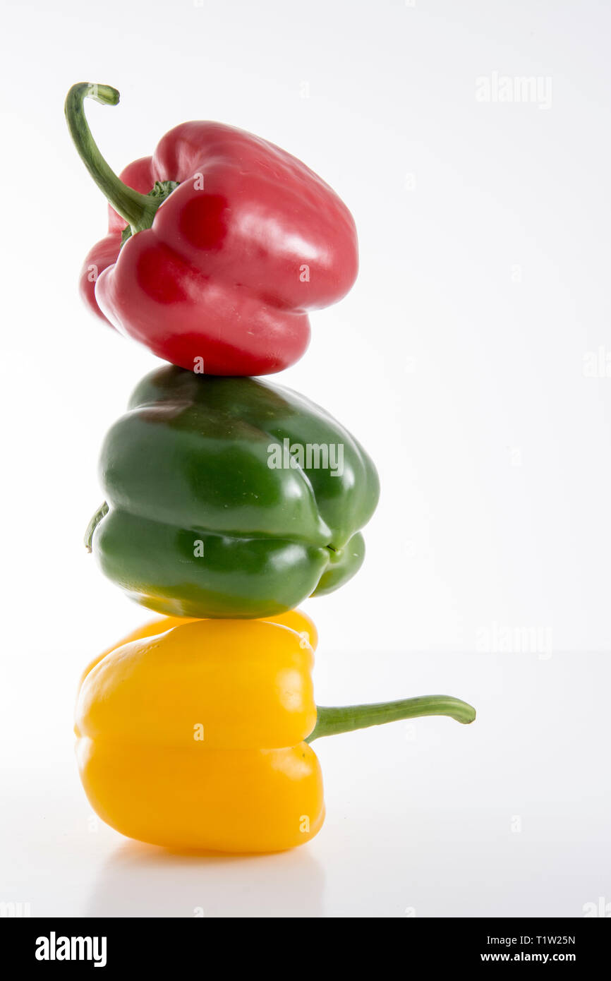 Red, green and yellow British peppers on white background Stock Photo ...
