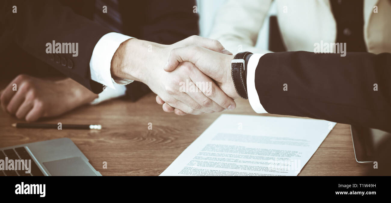 Business people shaking hands at meeting or negotiation in the office ...