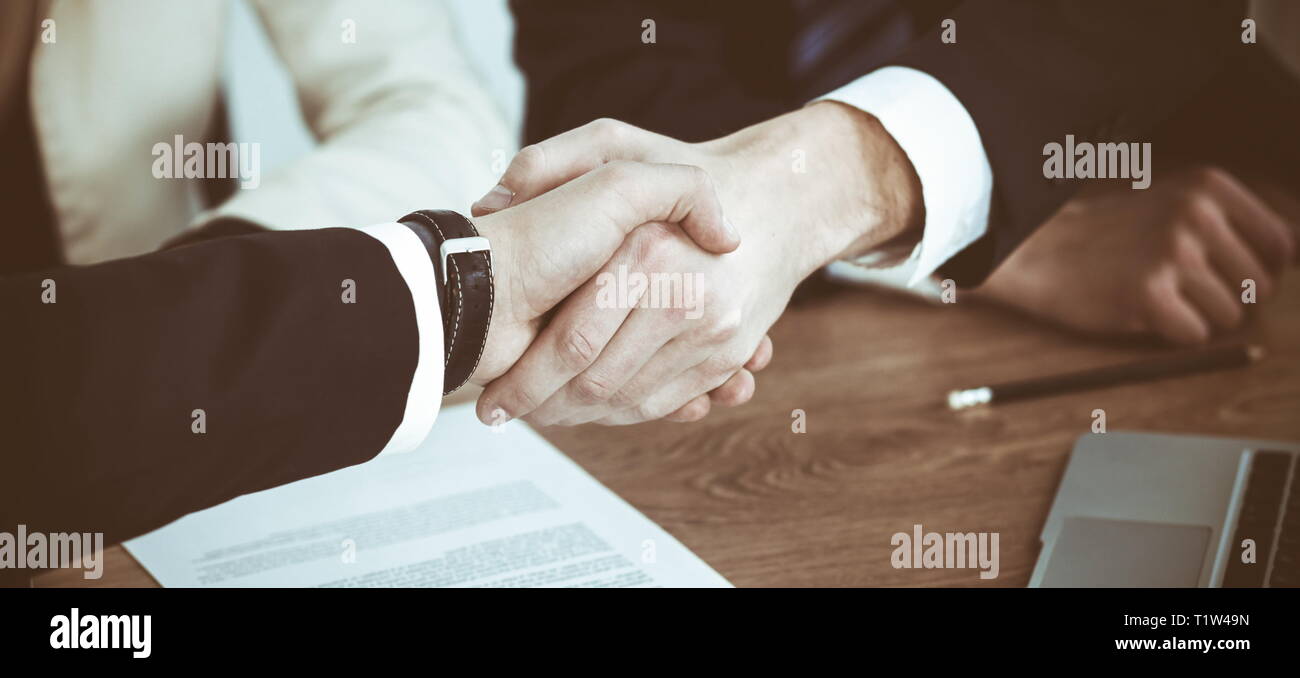Business people shaking hands at meeting or negotiation in the office ...