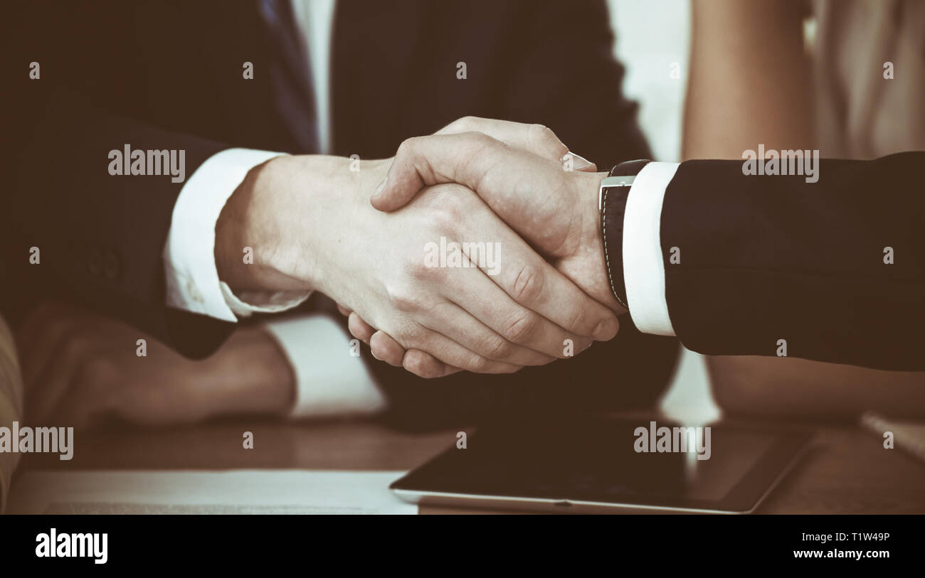 Business people shaking hands at meeting or negotiation in the office ...