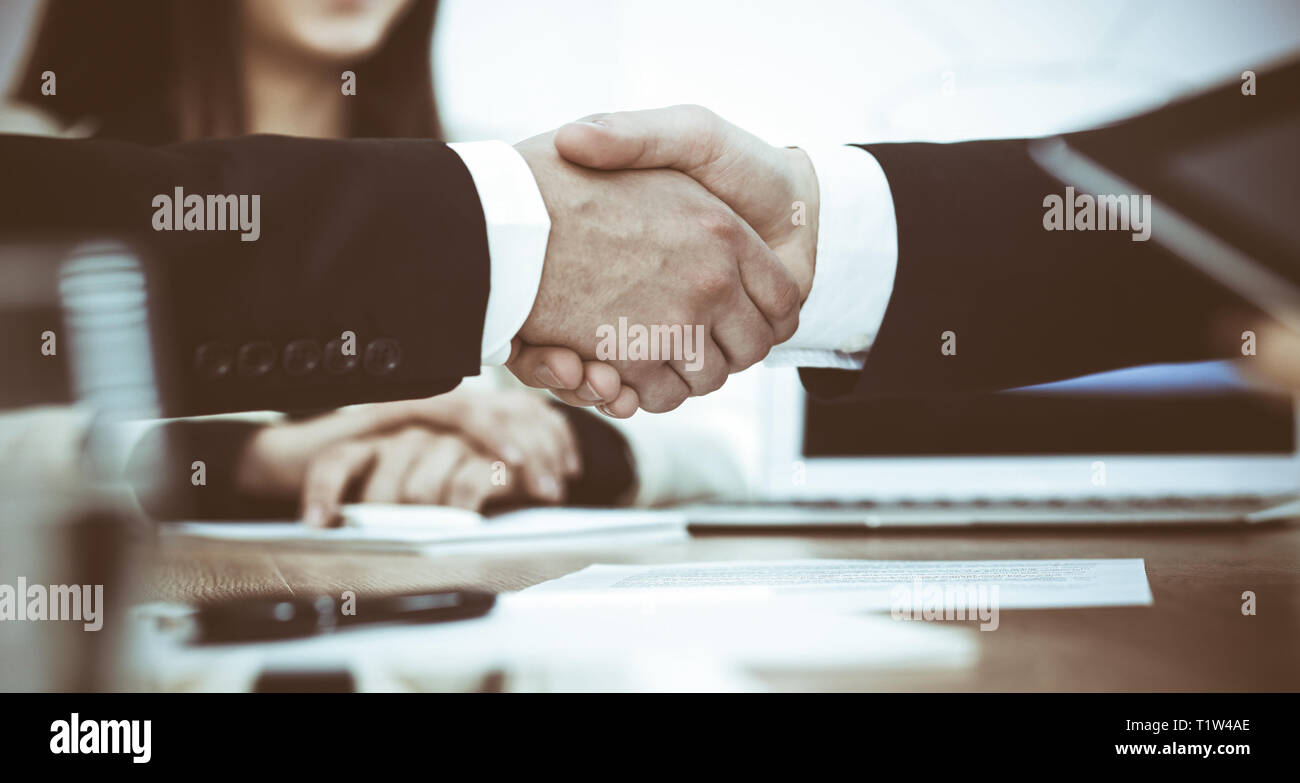 Business people shaking hands at meeting or negotiation in the office ...