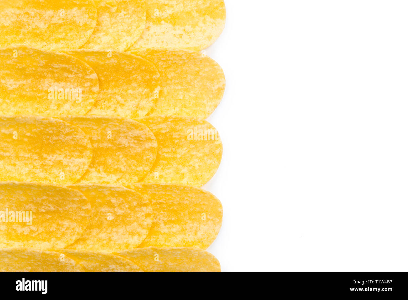 yellow potato chips isolated on white Stock Photo - Alamy