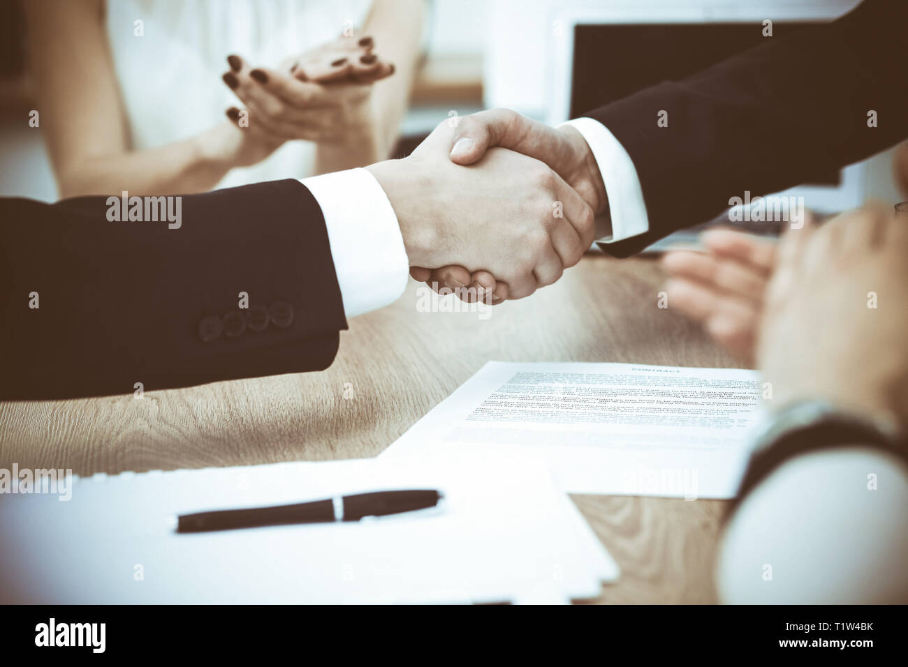 Business people shaking hands at meeting or negotiation in the office ...