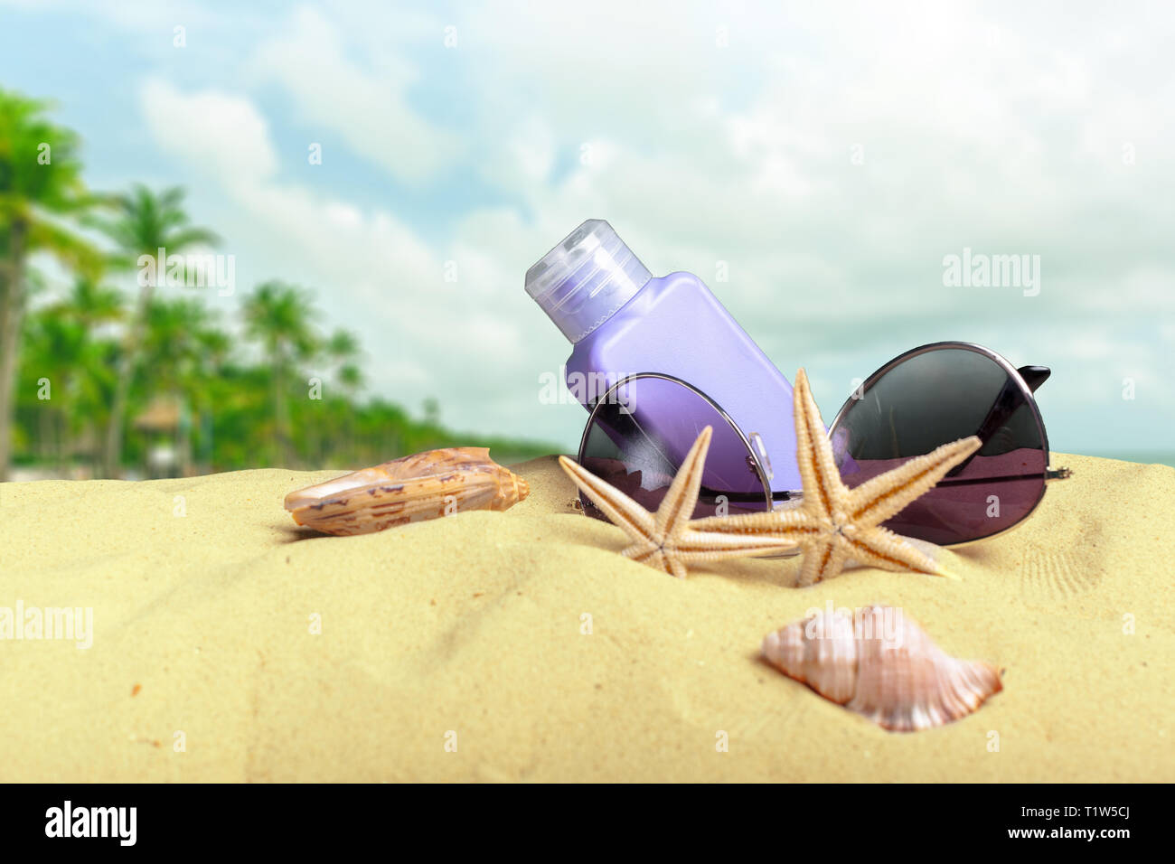 Sun protection set on beach Stock Photo - Alamy