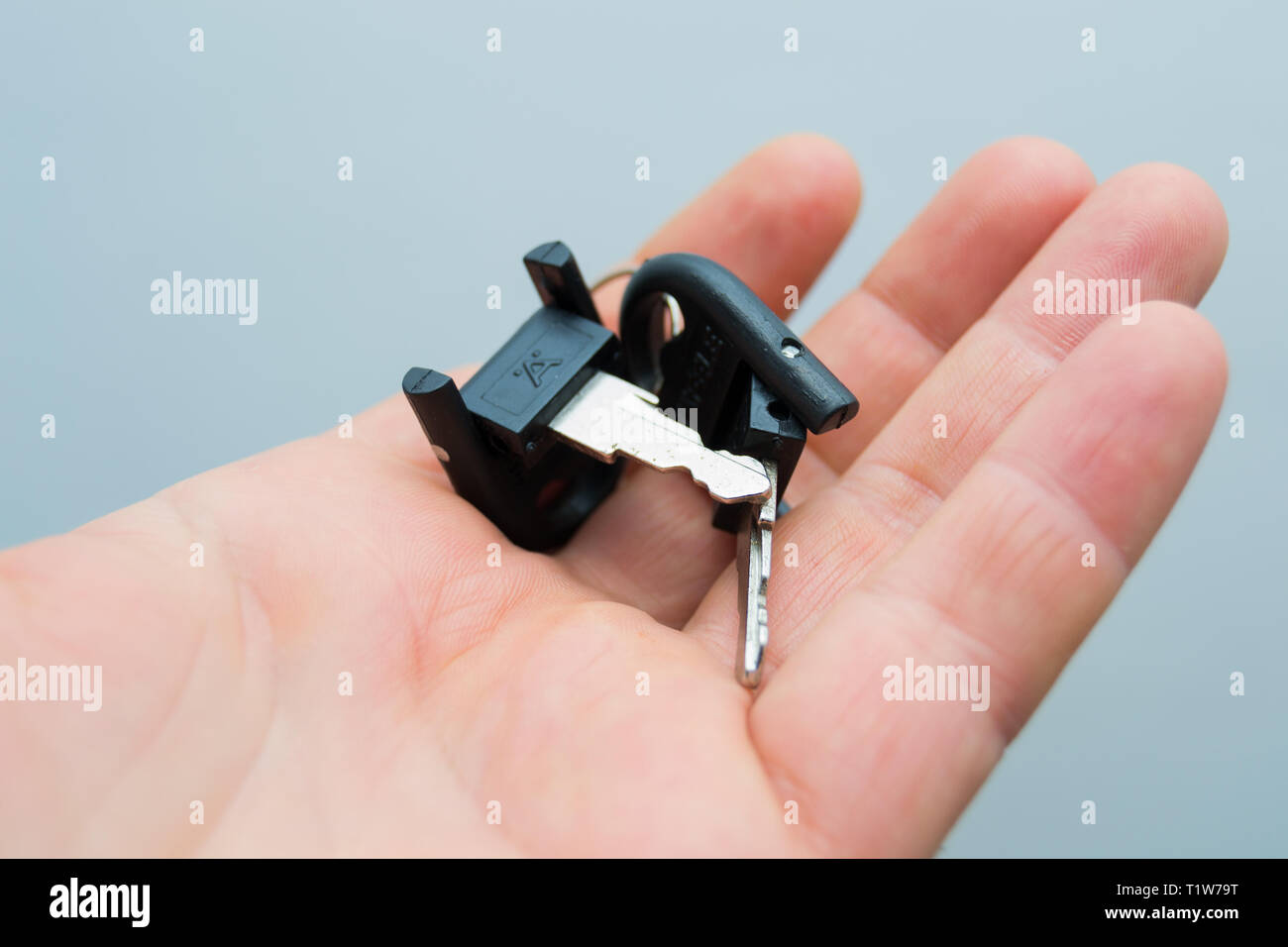 Small keys in human hand Stock Photo - Alamy