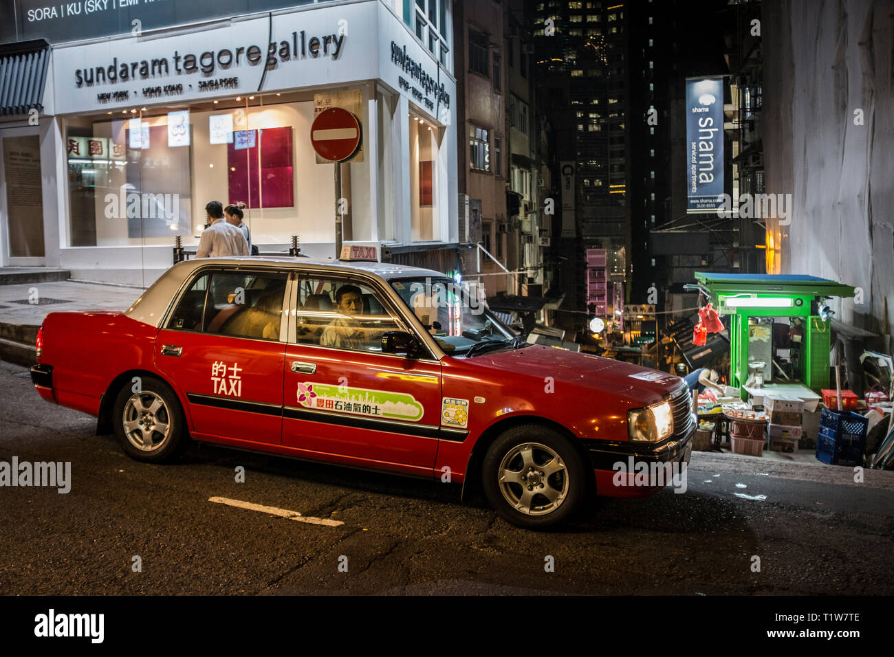 Red taxi in Hong Kong Stock Photo - Alamy