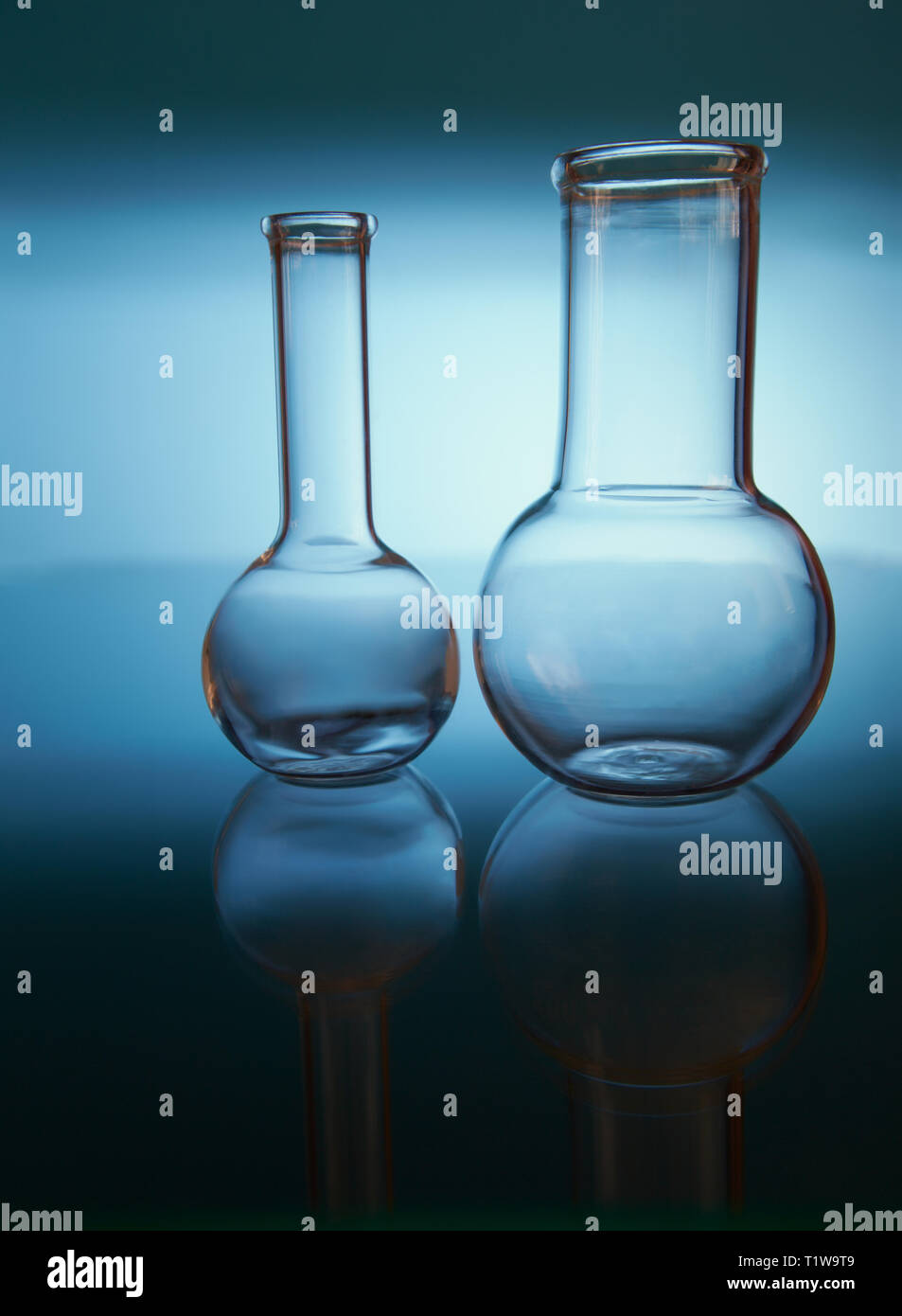 two beacons in the backlight, reflection, blue background Stock Photo ...