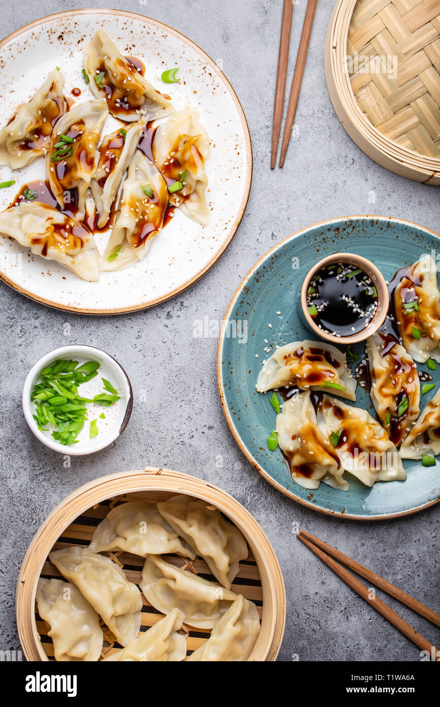 Two plates with asian dumplings Stock Photo - Alamy