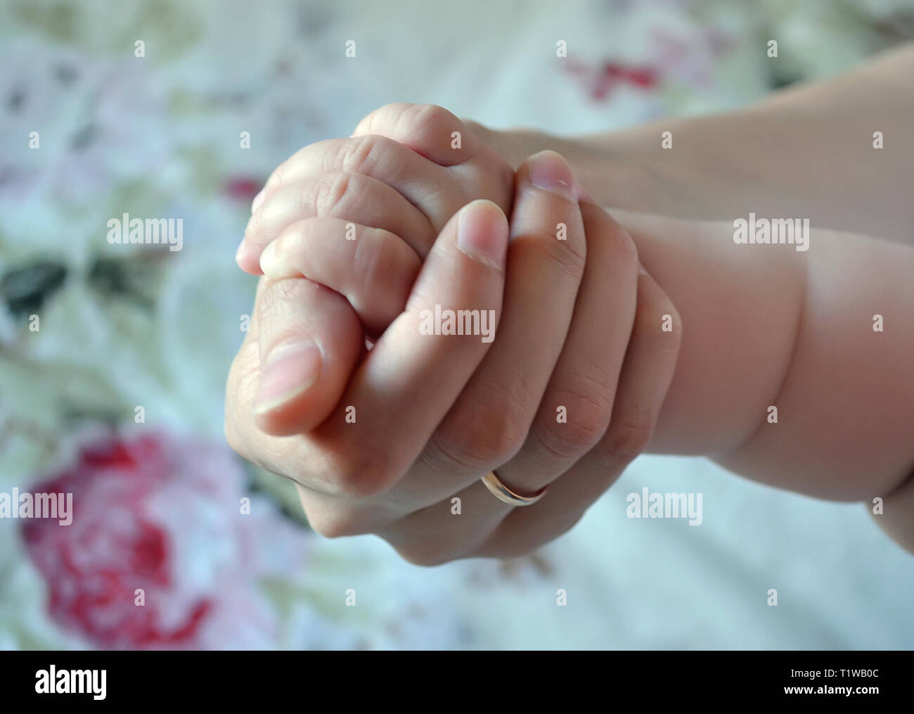 Baby hand holding finger ring hi-res stock photography and images - Alamy