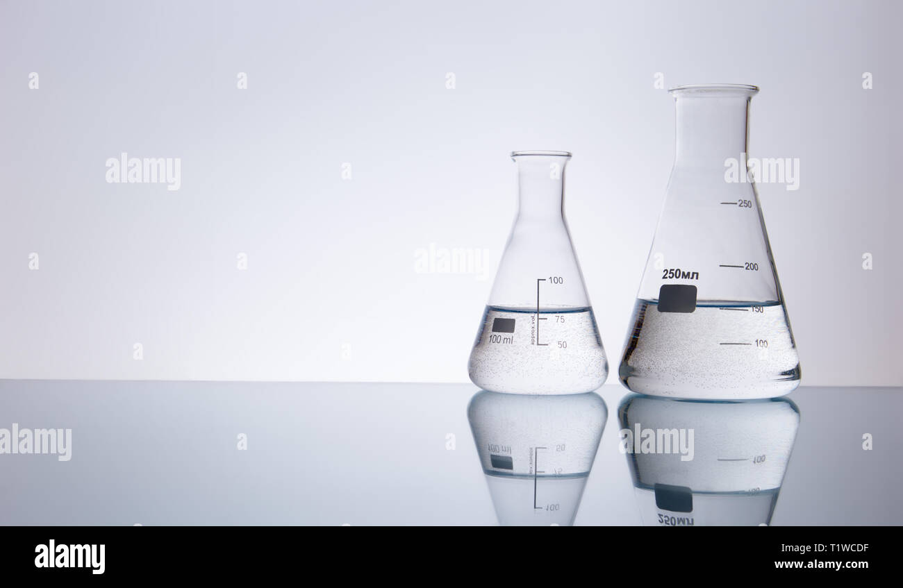 two beacons in the backlight, reflection, blue background Stock Photo ...