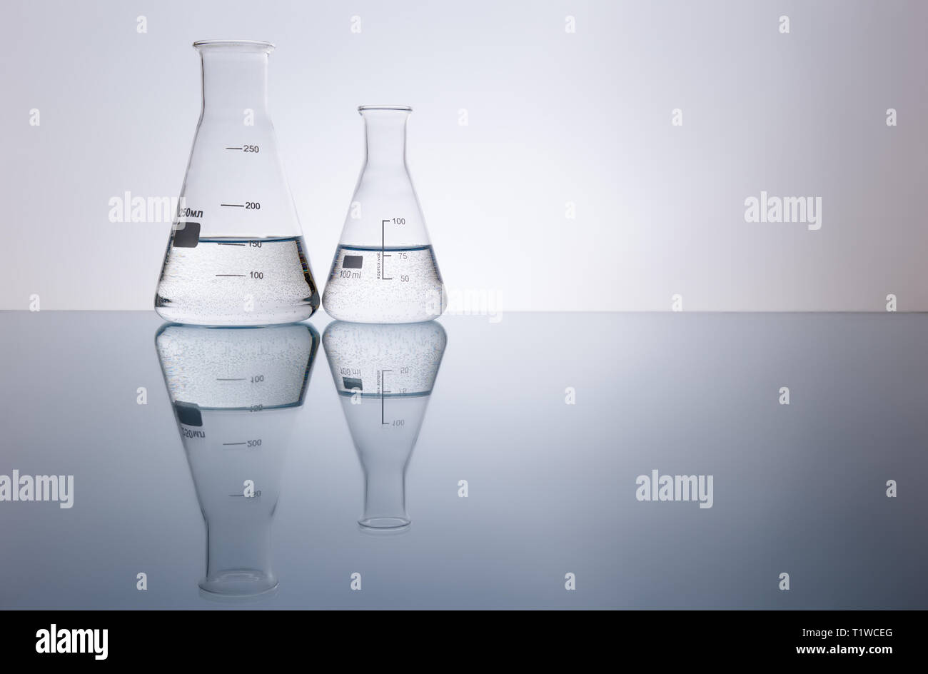 two beacons in the backlight, reflection, blue background Stock Photo ...